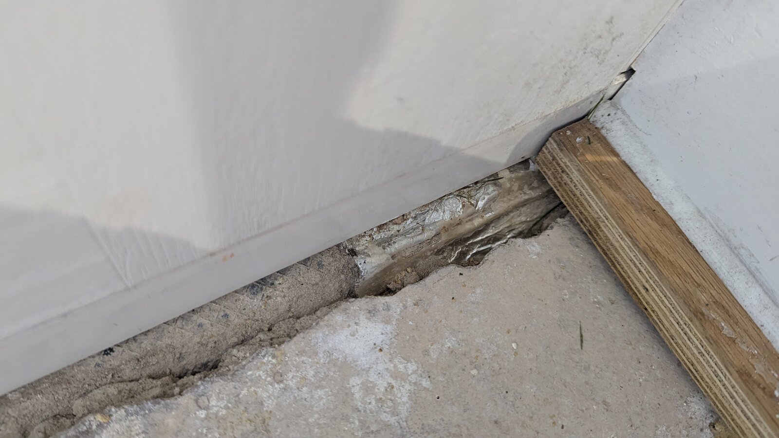 Damp underlay and crumbling floor at front door | DIYnot Forums