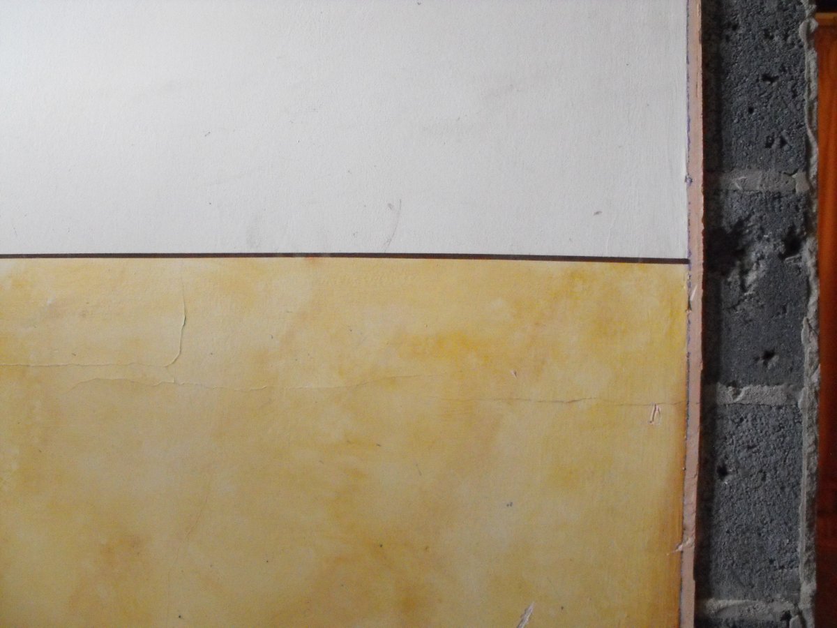 Interior single skin concrete blockwork wall behind radiator cracked ...