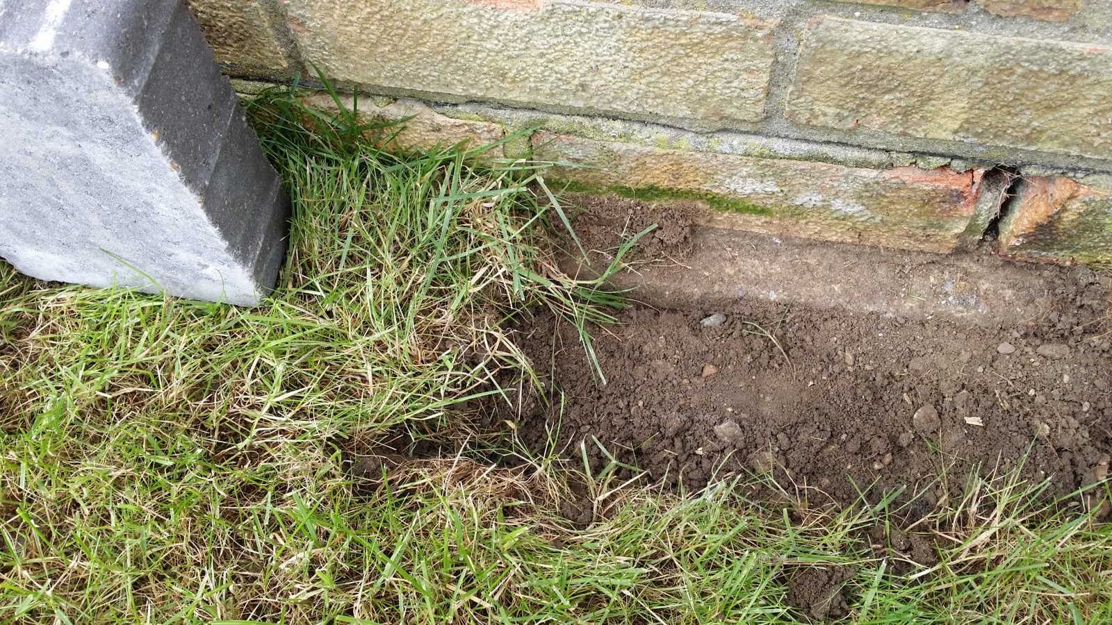 Remove part of a garage base edge to lay paving bricks? | DIYnot Forums