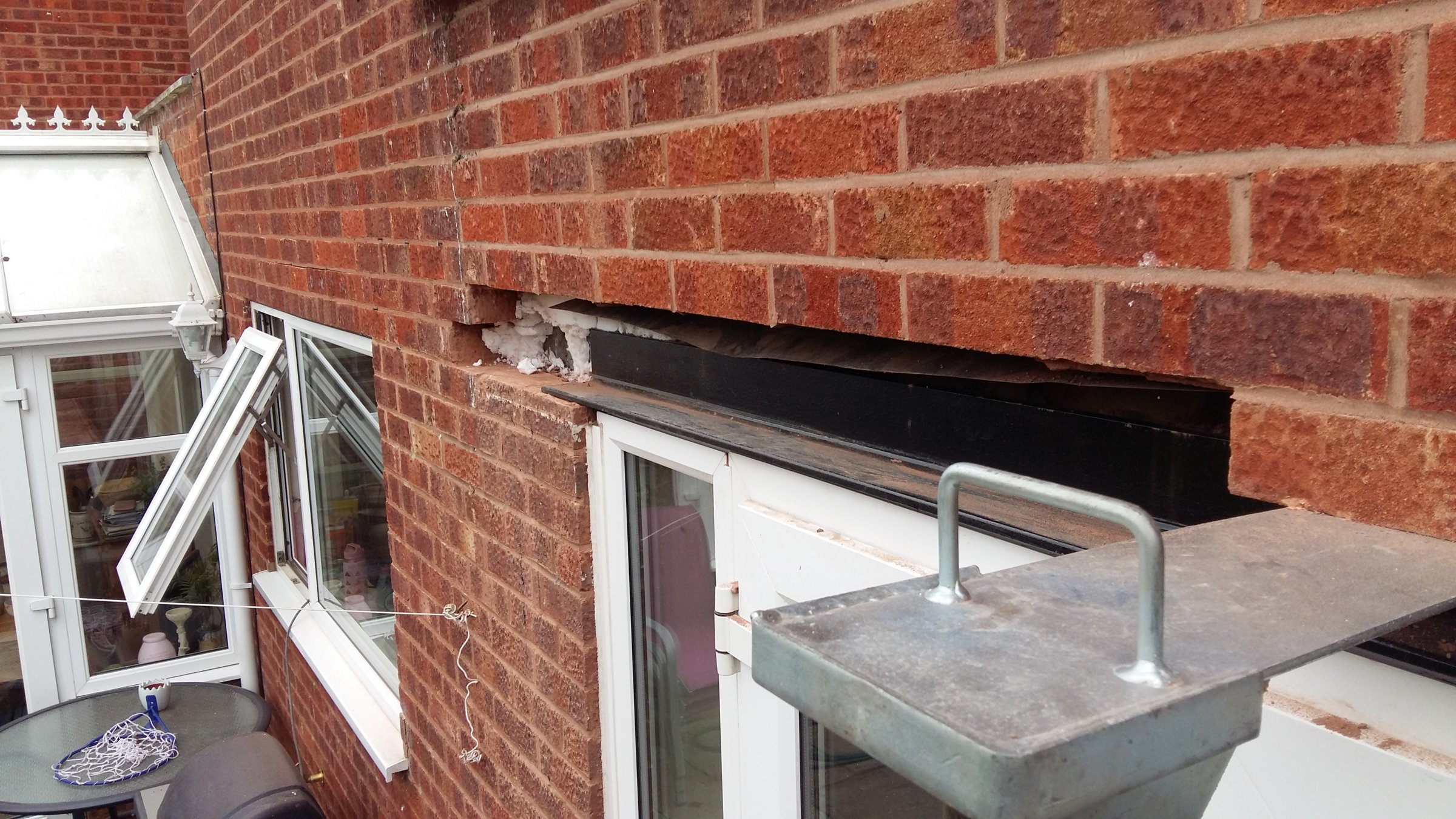 Cut and cover part of solider course above window | DIYnot Forums
